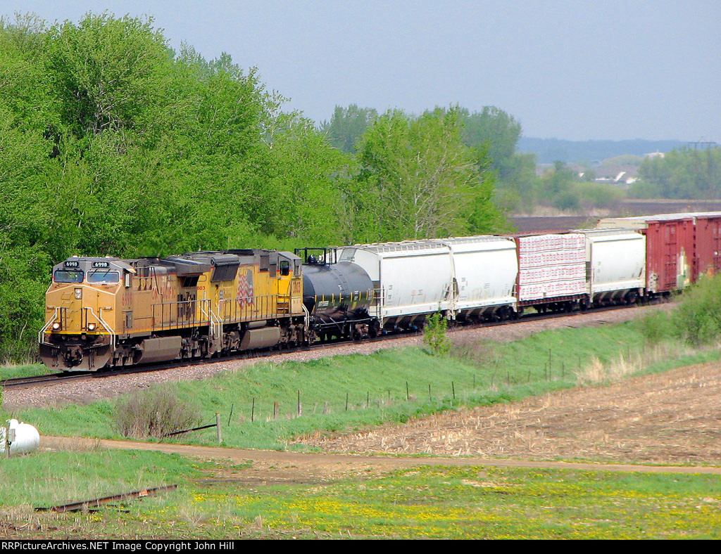 130519169 Southbound UP train about to meet northound CP just north of town